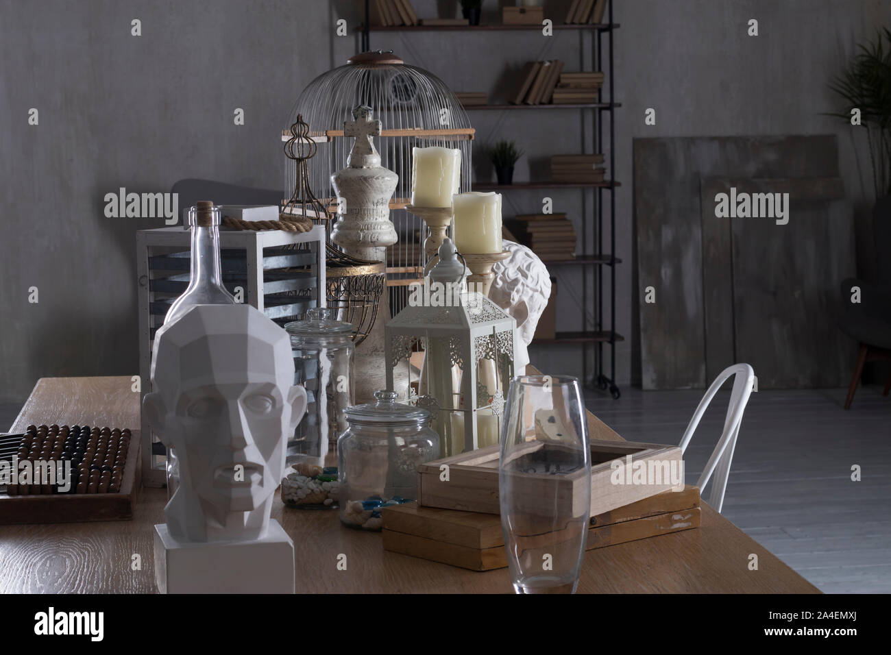 The table in the large room is full of different objects Stock Photo ...