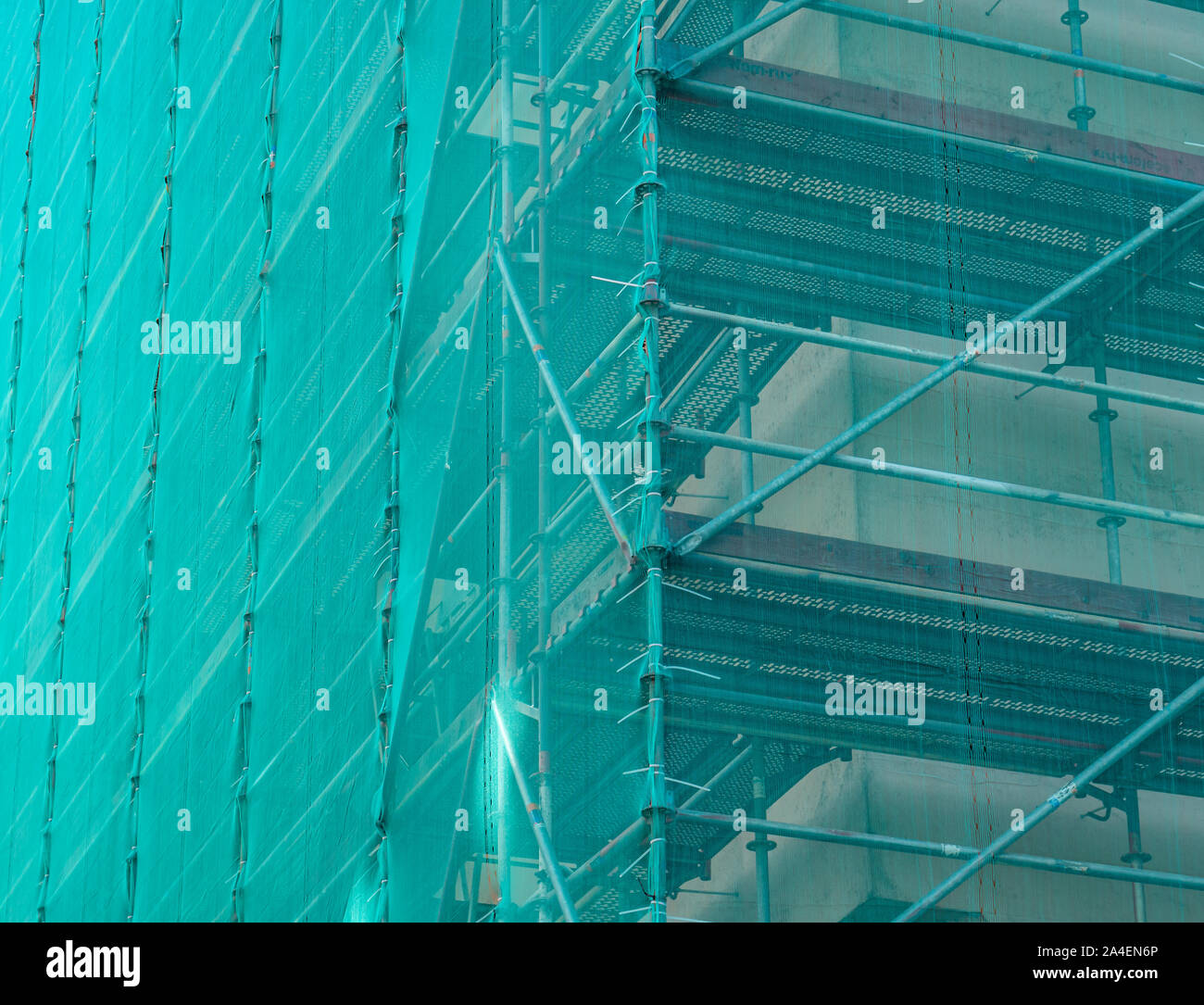 Building renovation scaffolding with net Stock Photo - Alamy