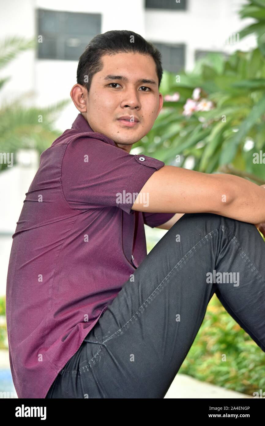 Filipino Male Sitting Stock Photo - Alamy