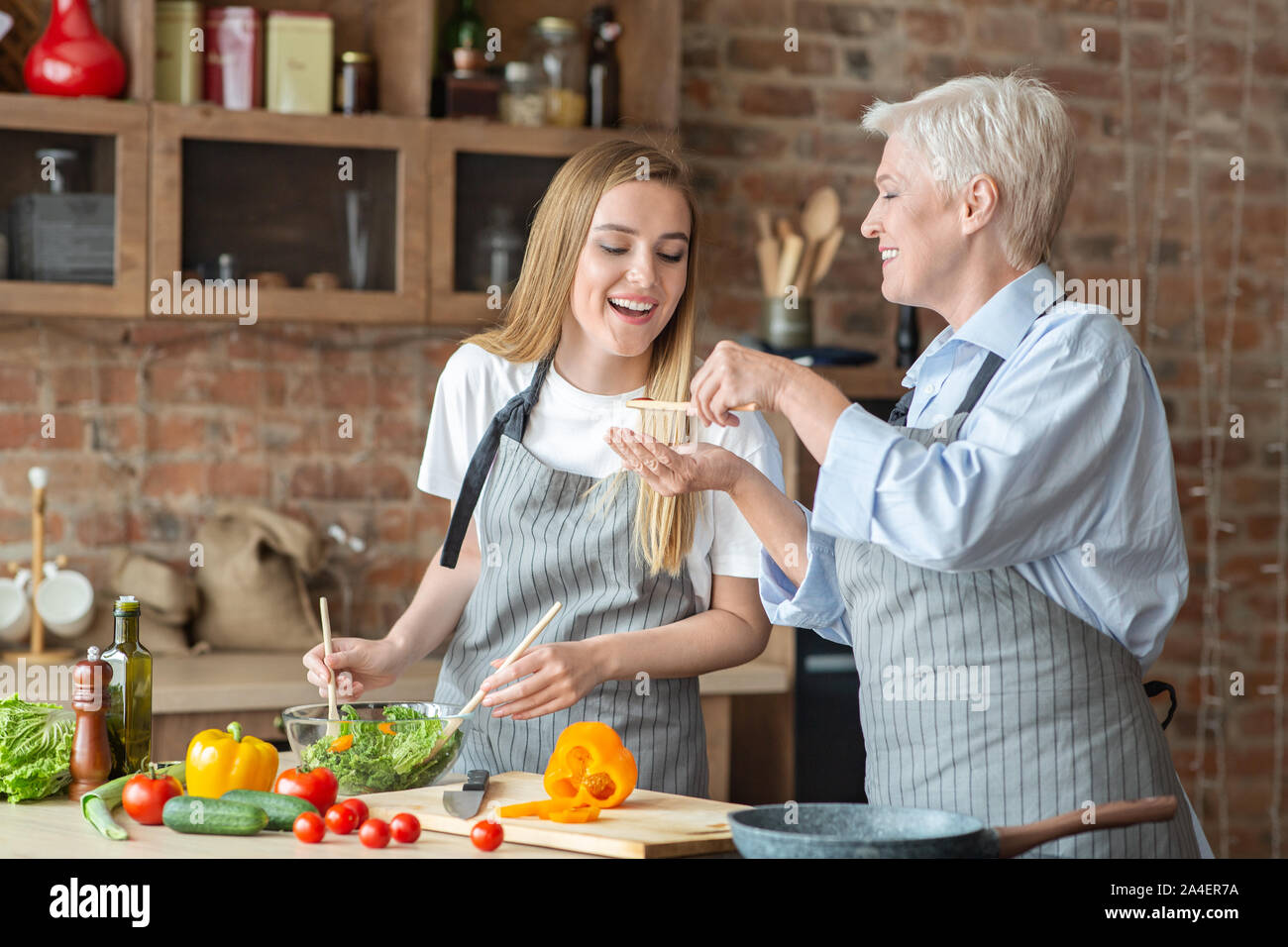 Young woman helping her old mother with dinner Stock Photo - Alamy Young woman helping her old mother with dinner Stock Photo - Alamy