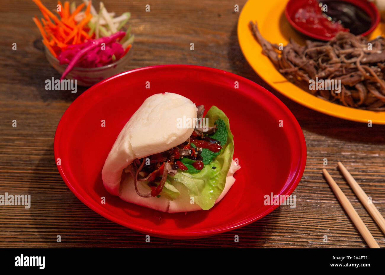 Bao bun delicious Vietnamese meat dish with sauces Stock Photo - Alamy