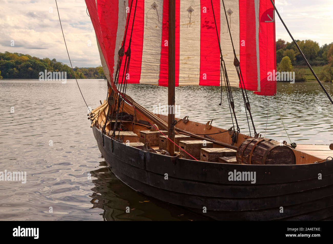 Viking ship replica; long oars; red and white striped sail; wood boat ...