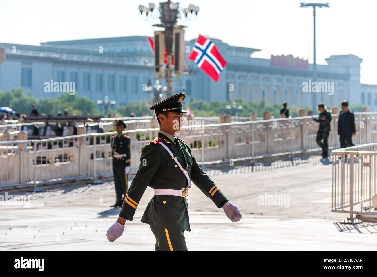 Security guard walking in front of the Tiananmen Gate, at the entrance ...
