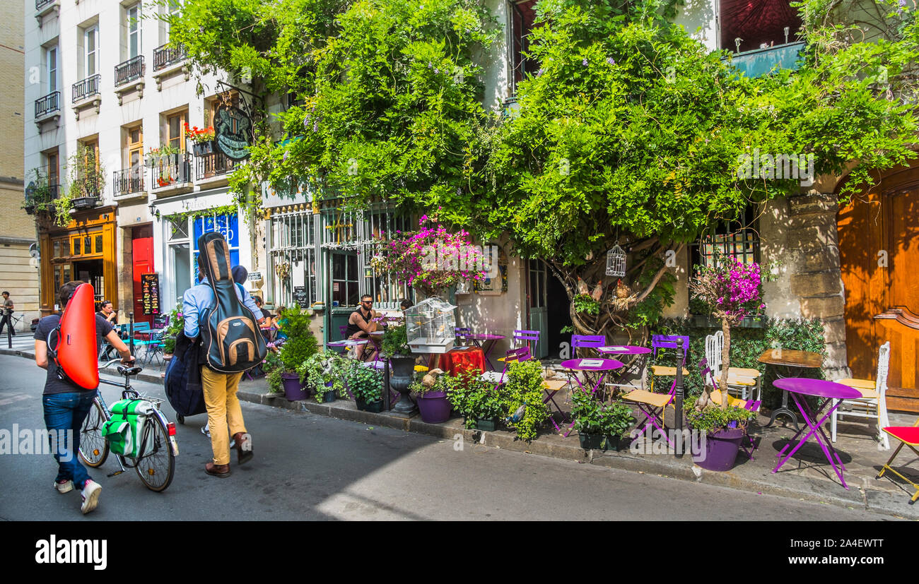 street scene in front of portuguese wine bar, food supply store and ...