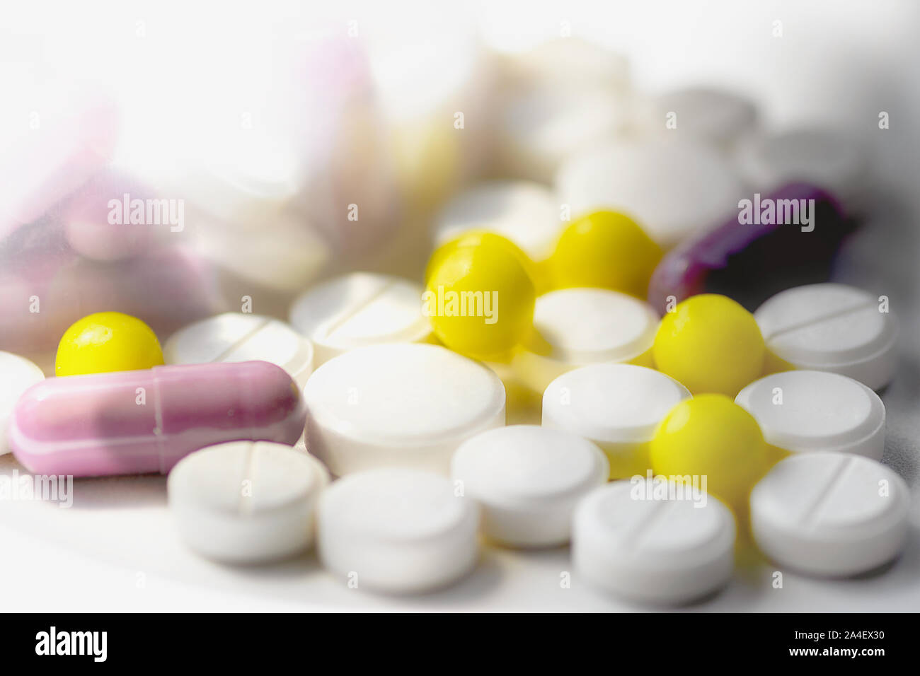 medicines various tablets and capsules on a white background with ...