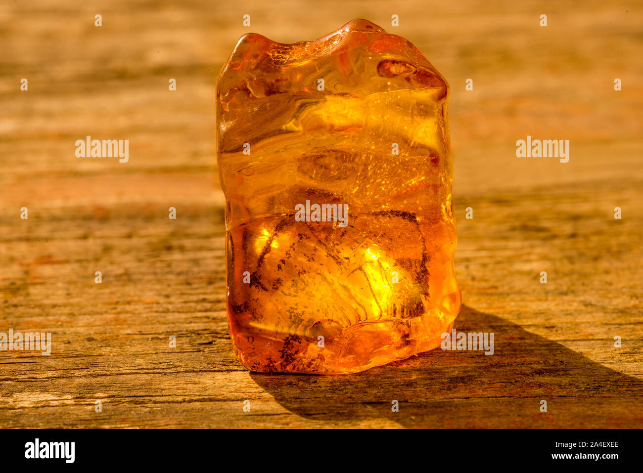 Amber in sun with inclusions Stock Photo - Alamy