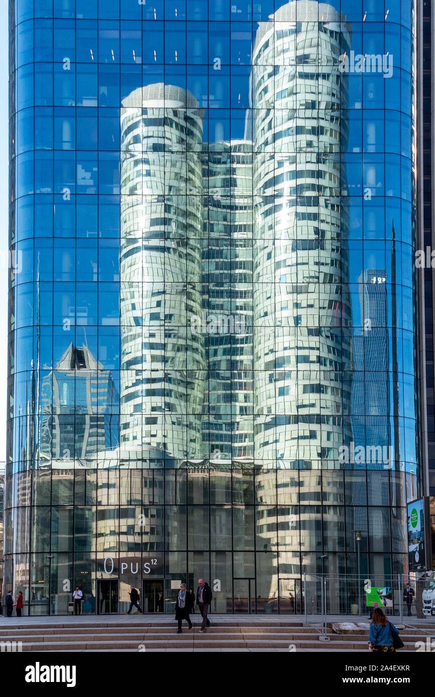 OPUS 12 GLASS BUILDING WITH THE REFLECTION OF THE COEUR DEFENSE TOWERS ...