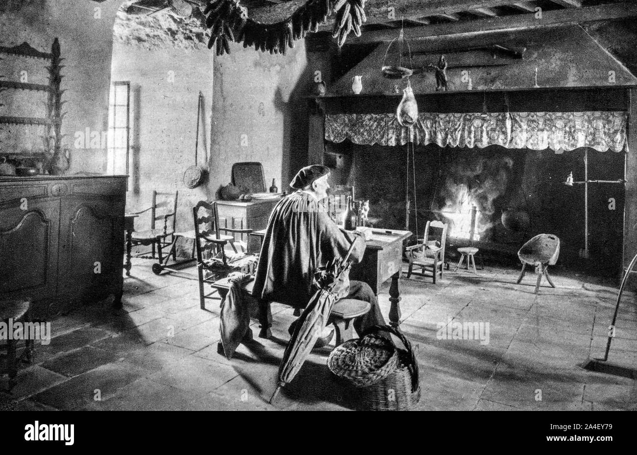 OLD MAN IN FRONT OF HIS FIREPLACE, INTERIOR OF A HOUSE IN NORMANDY ...