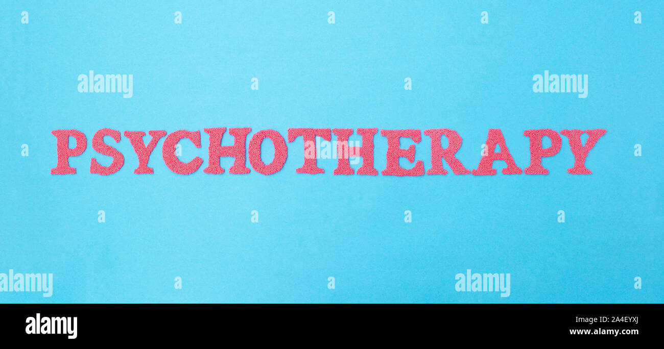 Inscription Psychotherapy in red letters on a blue background. The ...