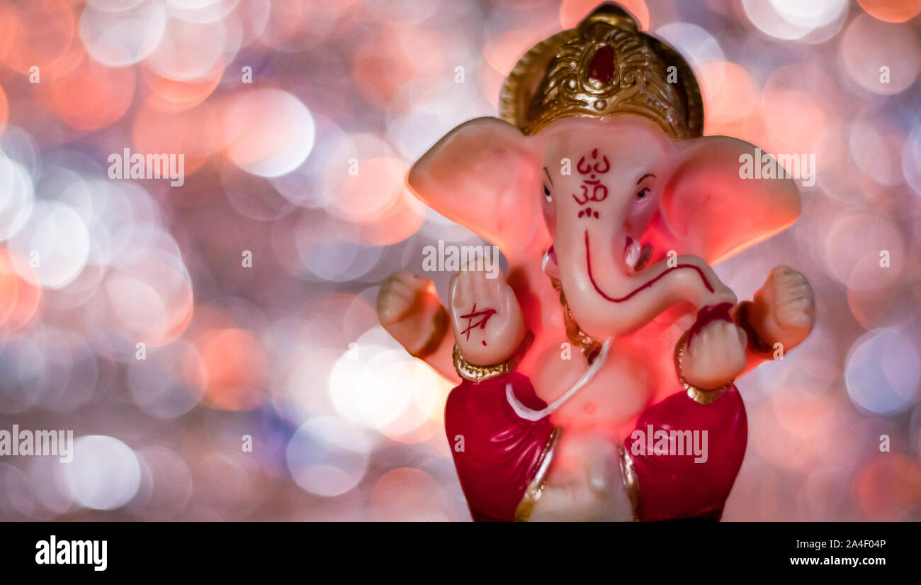 Ganesha statue with beutiful lights in the background for Ganpati pooja ...