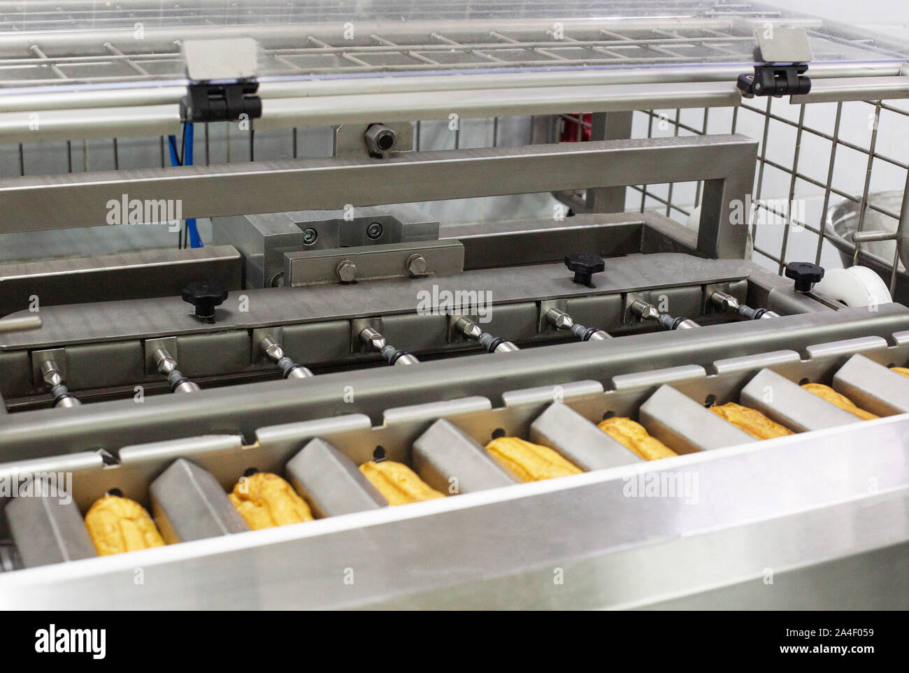 Automatic modern custard cake line with cream and boiled condensed milk ...