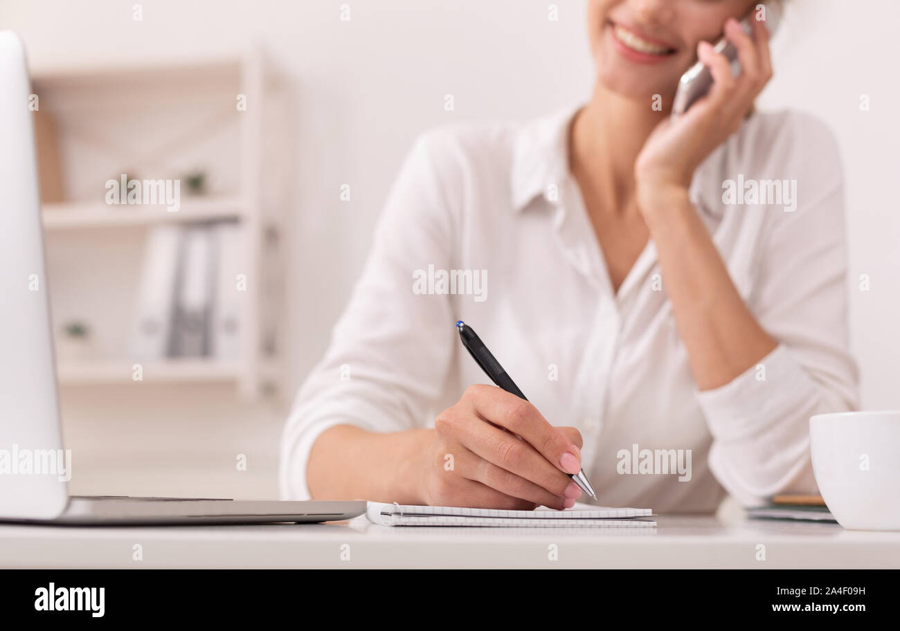 Unrecognizable Lady Talking On Phone Taking Notes At Workplace, Cropped ...