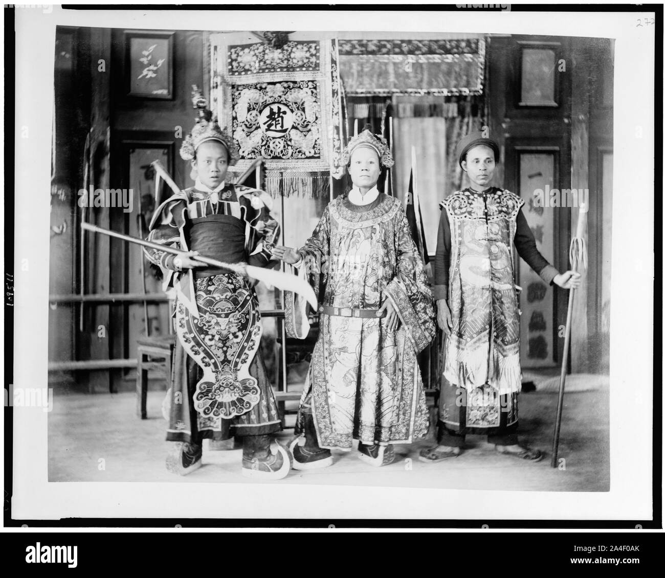 Three actors from Theatre Annamite, full-length portrait, in costumes ...