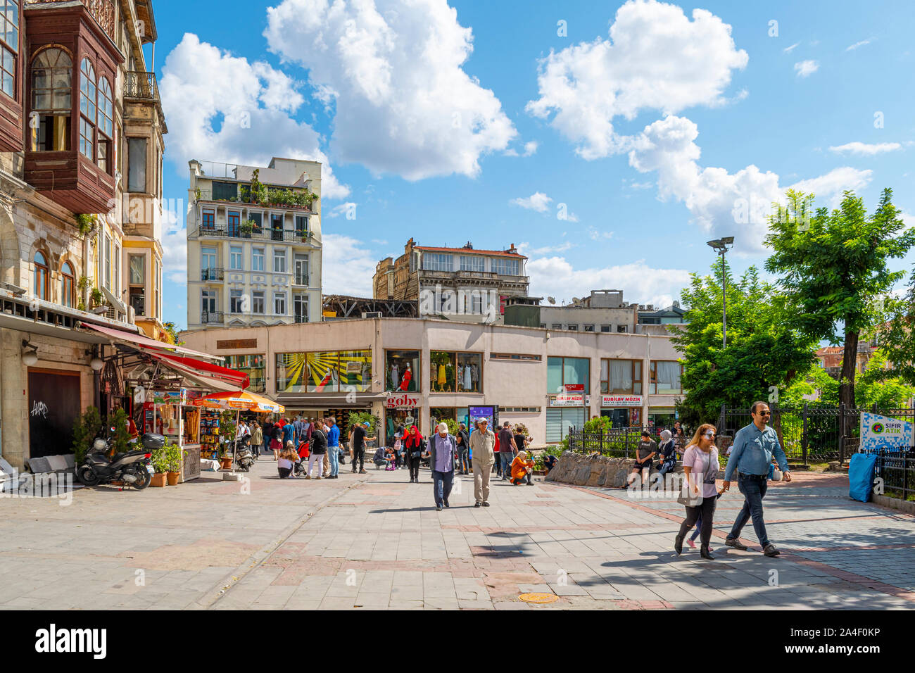 Tourists and local Turks enjoy a summer day in the Karakoy Galata ...