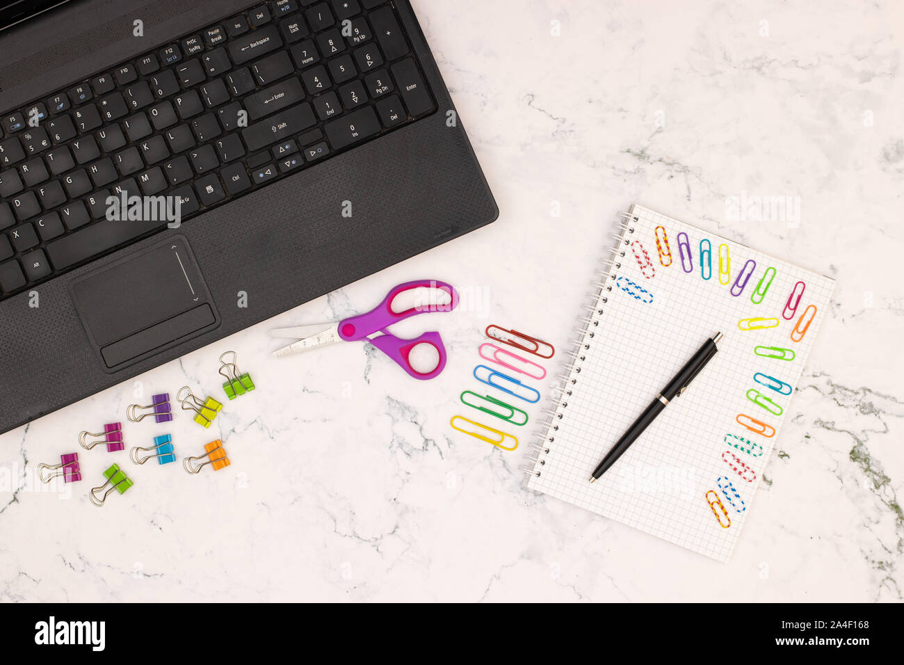 op view of office table. Office supplies on the table Stock Photo - Alamy