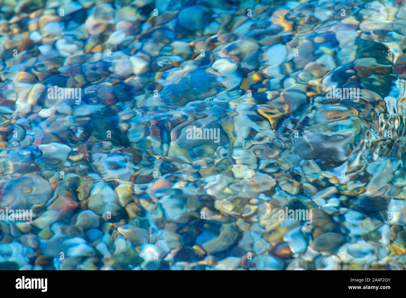 sea pebbles colored granite on the beach background stones. The shore ...