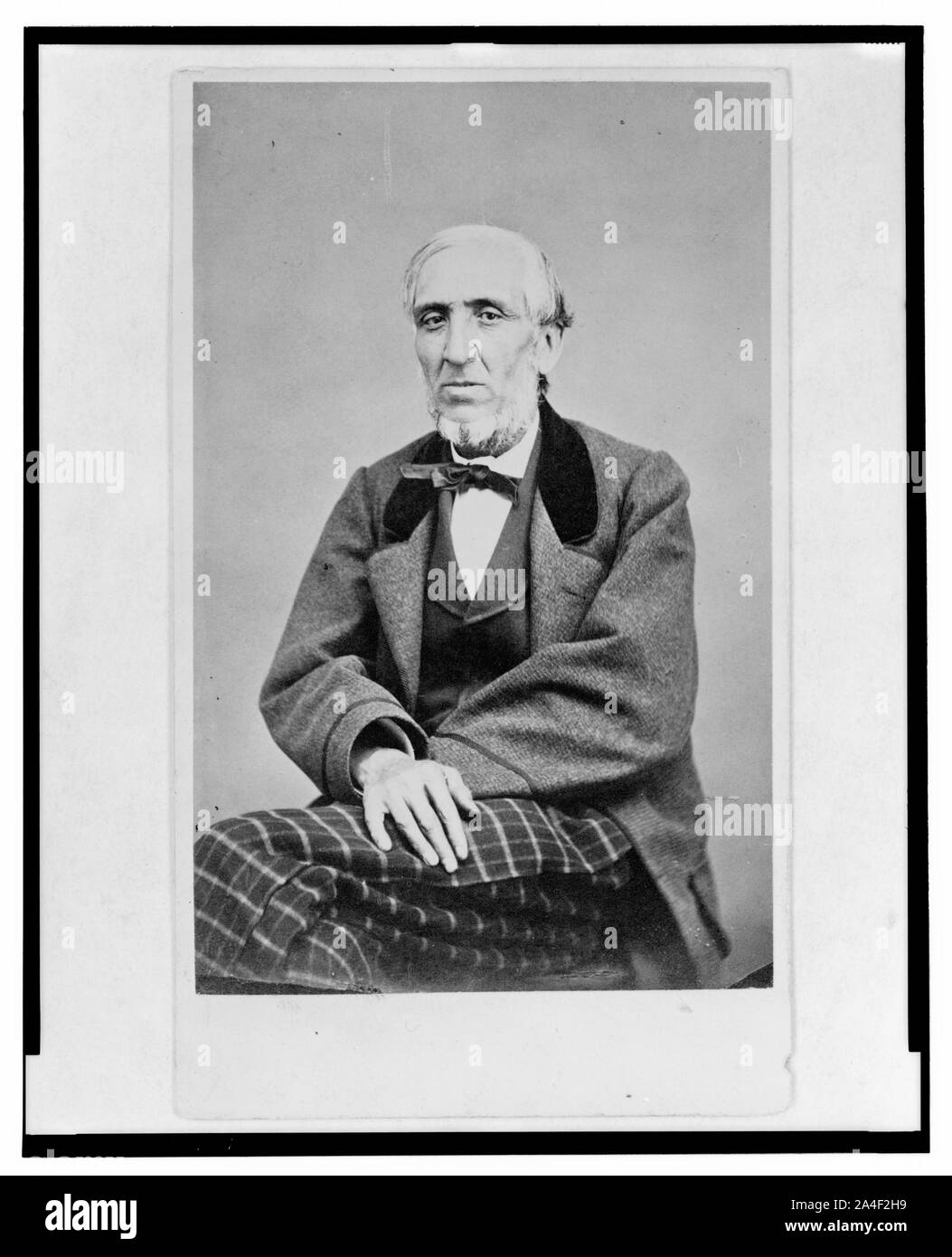 Three-quarter length portrait of a man, seated, facing front Stock ...