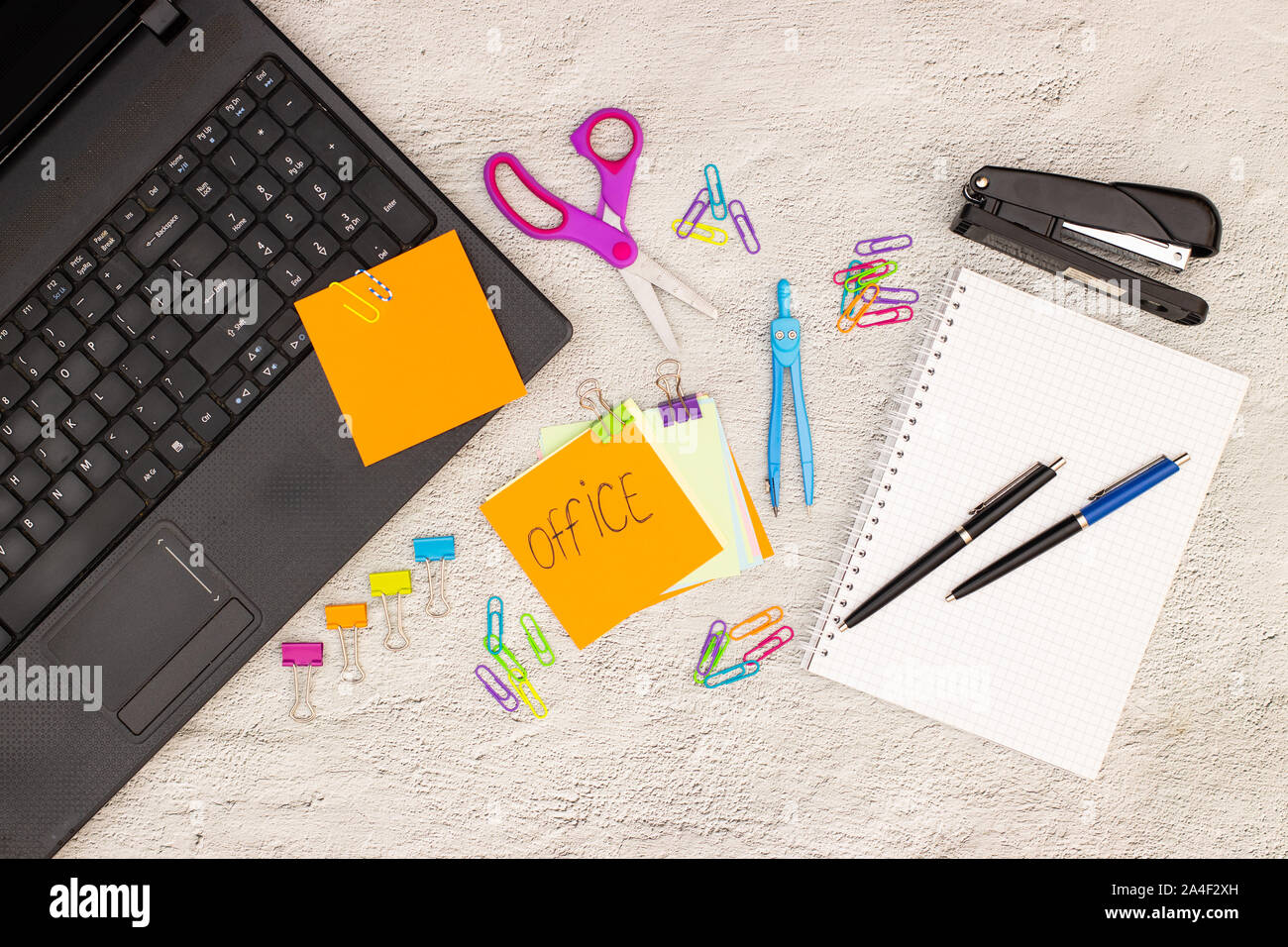 Top view of office table. Office table full with office supplies and ...