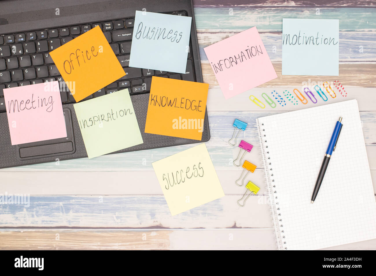 Top view of office table. Office table full with office supplies and ...