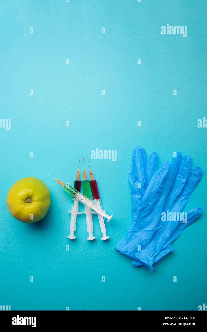 Chemical additives in food or genetically modified fruit concept. Green ...