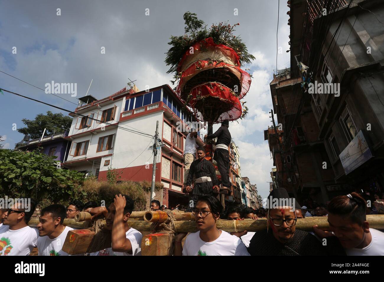 Kathmandu, Nepal. 14th Oct, 2019. People rotate a traditional chariot ...