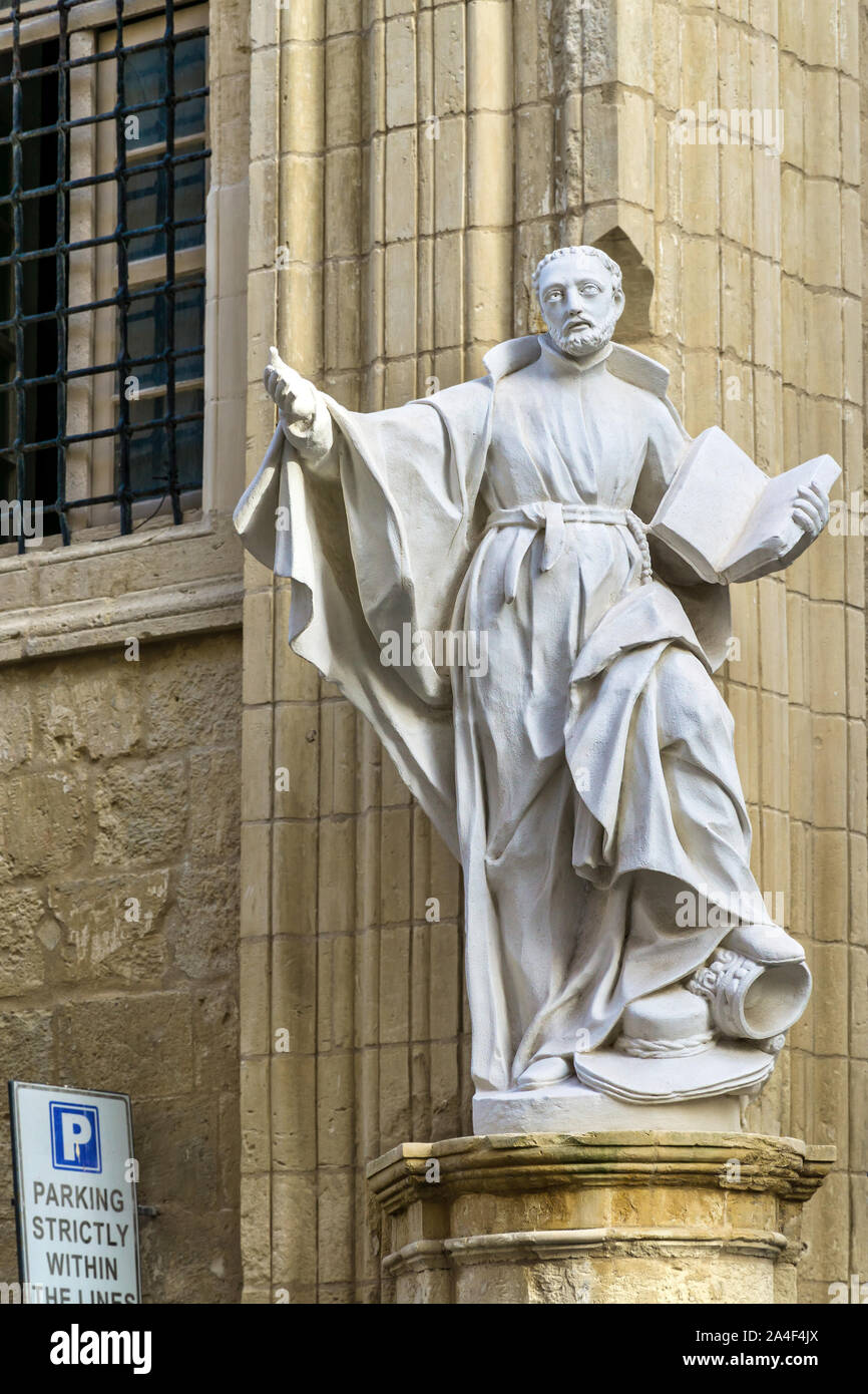 One of the hundreds of street niches with statues of saints on the ...