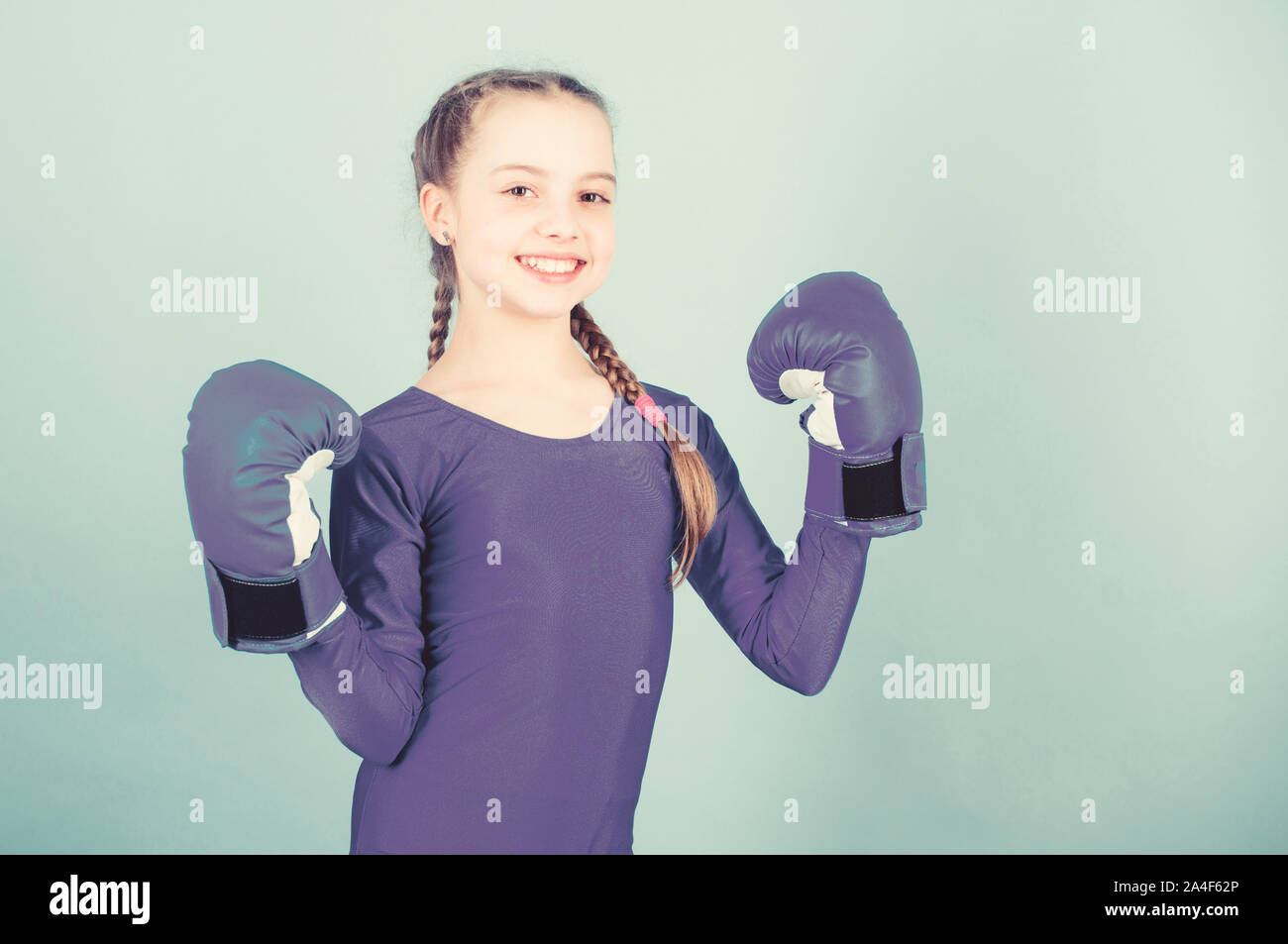 Girl cute boxer on blue background. Rise of women boxers. Female boxer ...