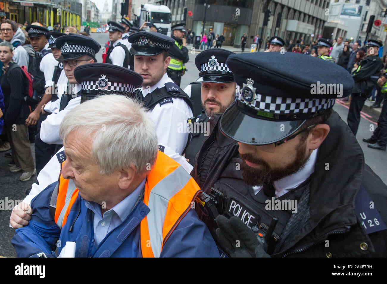 London, UK. 14 October, 2019. Police officers push back a legal ...
