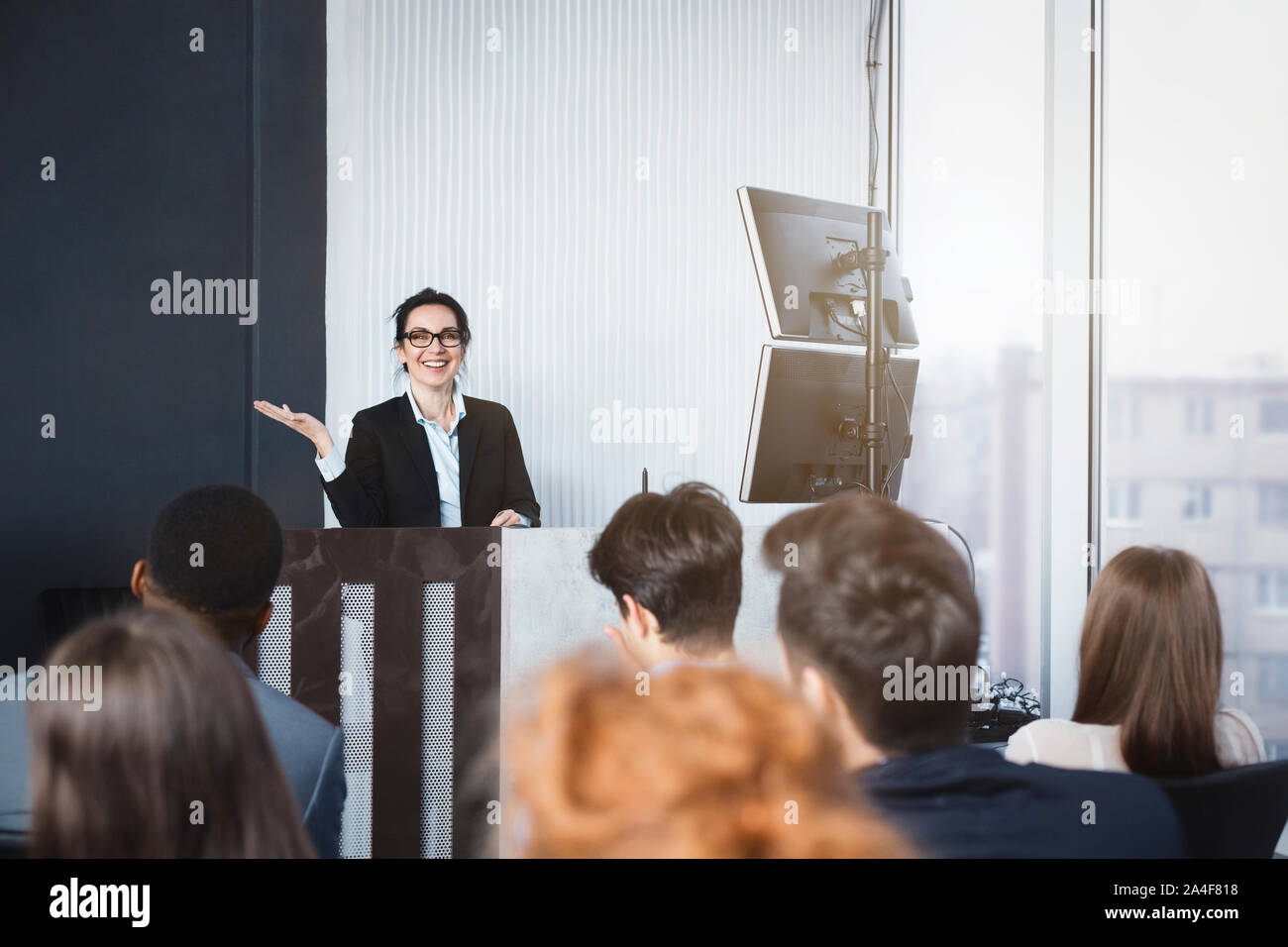 Business woman giving presentation at conference room Stock Photo - Alamy