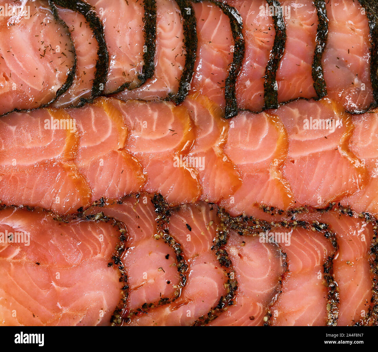 Smoked salmon slices for seafood background Stock Photo - Alamy