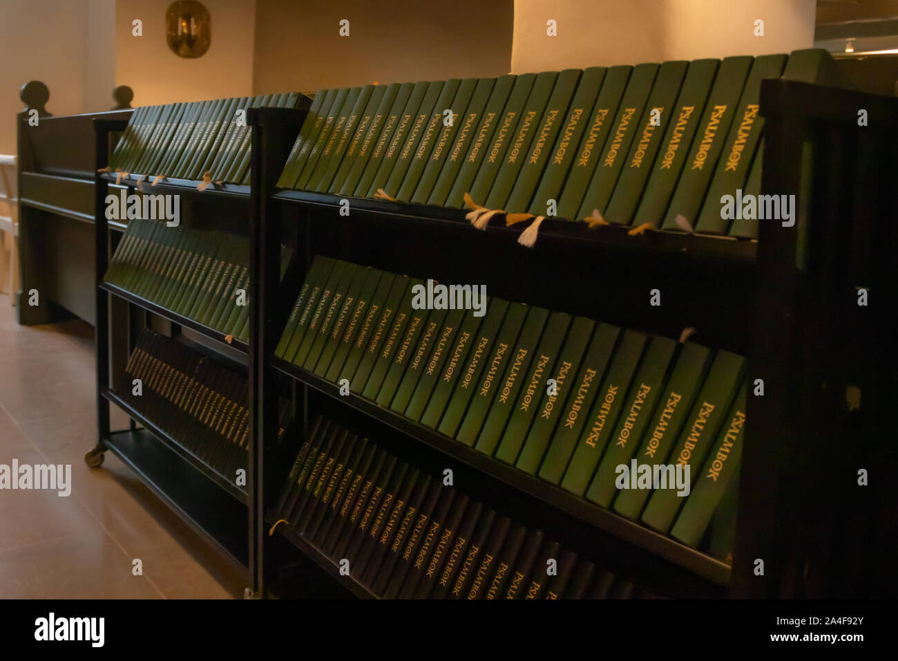 Porvoo, Finland - 2 October 2019: Closeup of a row of green hymn books ...