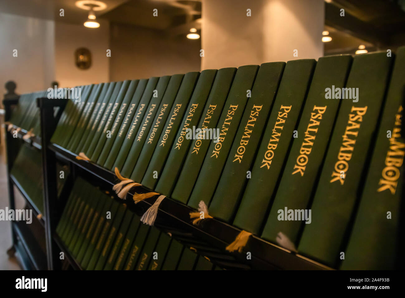 Porvoo, Finland - 2 October 2019: Closeup of a row of green hymn books ...