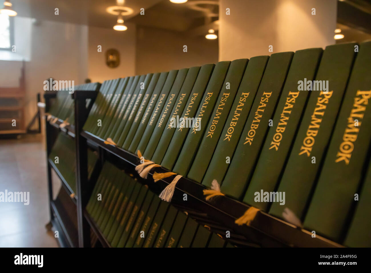 Porvoo, Finland - 2 October 2019: Closeup of a row of green hymn books ...