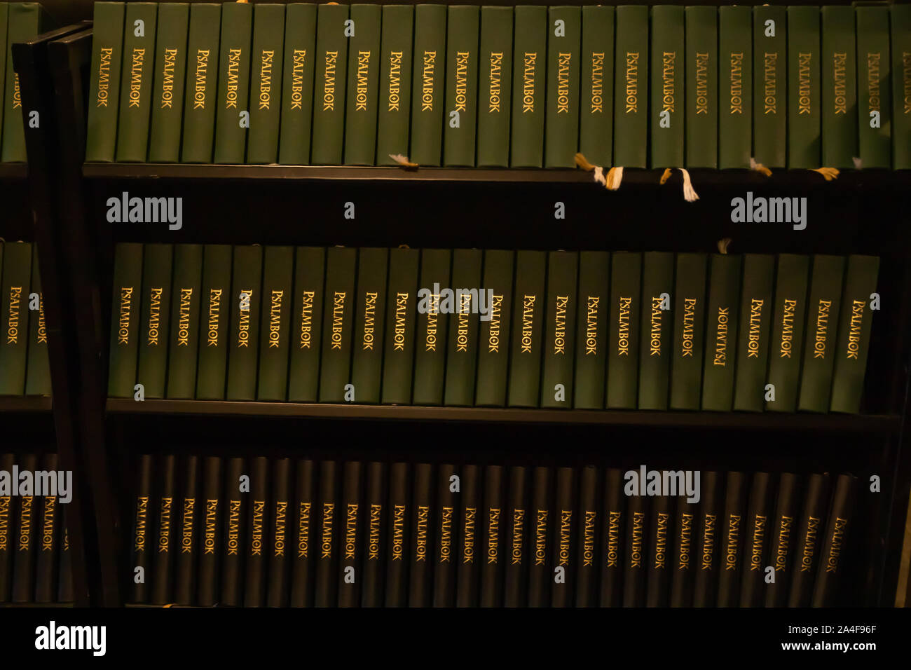 Porvoo, Finland - 2 October 2019: Closeup of a row of green hymn books ...