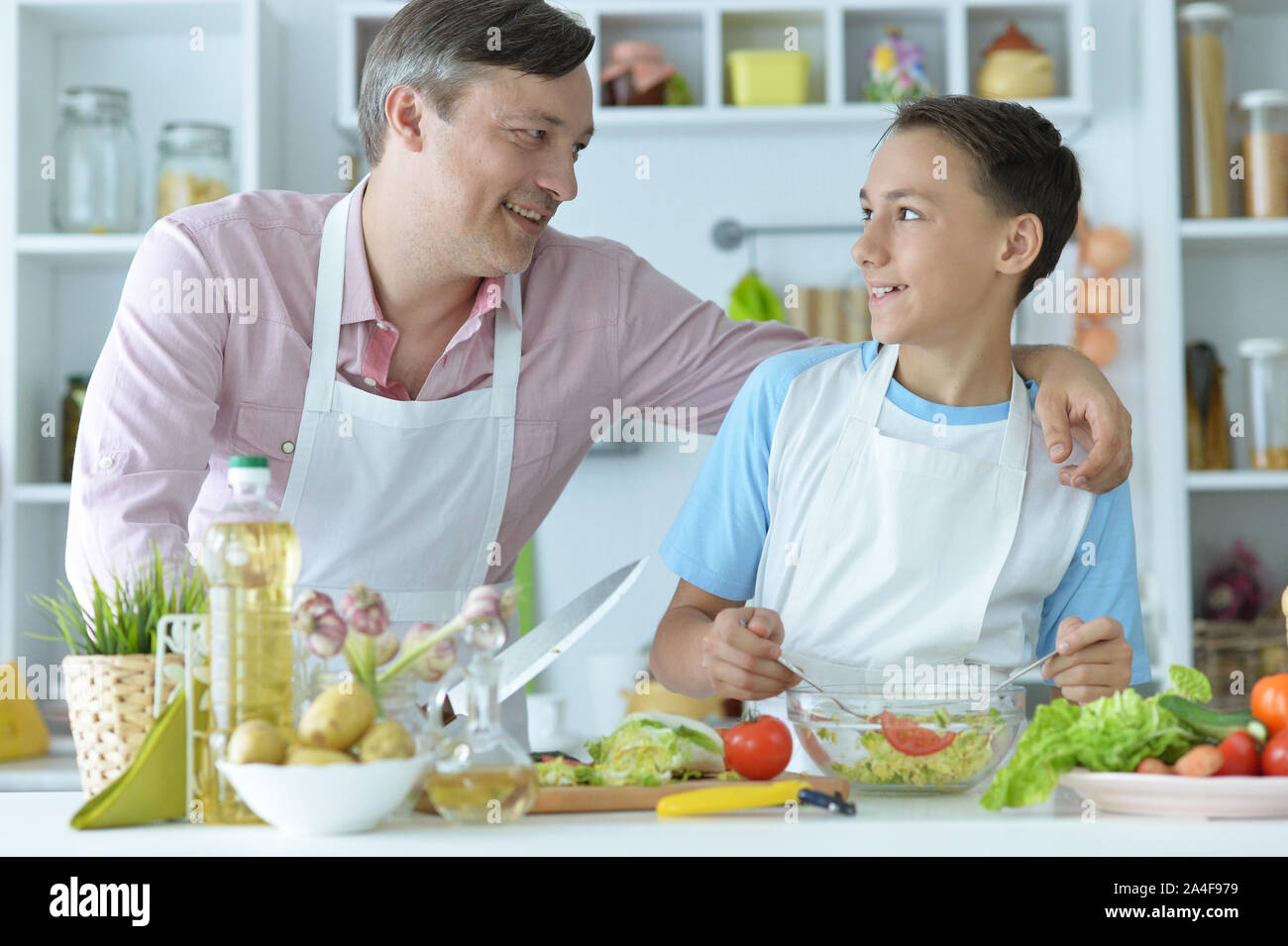 Father son cooking vegetables hi-res stock photography and images - Alamy