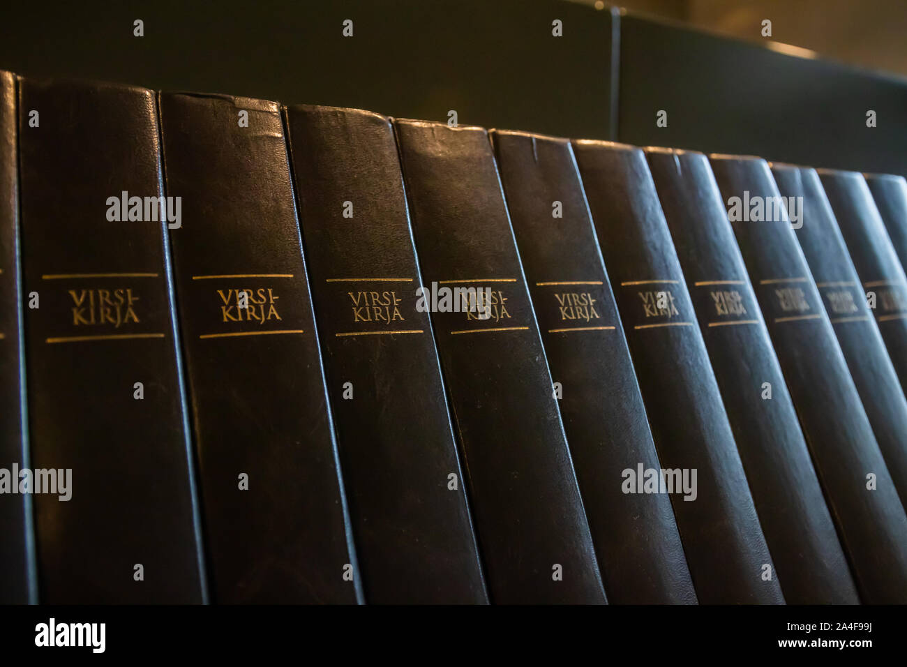 Porvoo, Finland - 2 October 2019: Closeup of a row of green hymn books ...