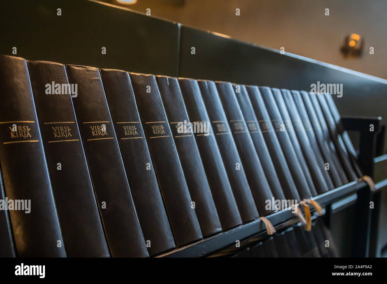 Porvoo, Finland - 2 October 2019: Closeup of a row of green hymn books ...
