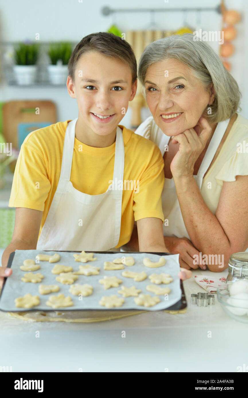 Old woman baking cookies hi-res stock photography and images - Alamy