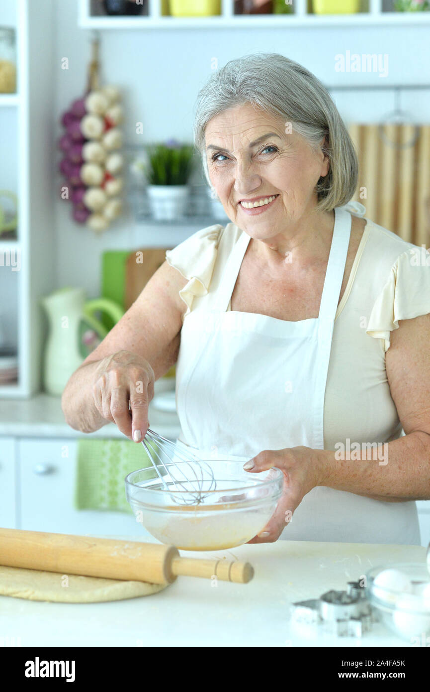 Old woman baking cookies hi-res stock photography and images - Alamy