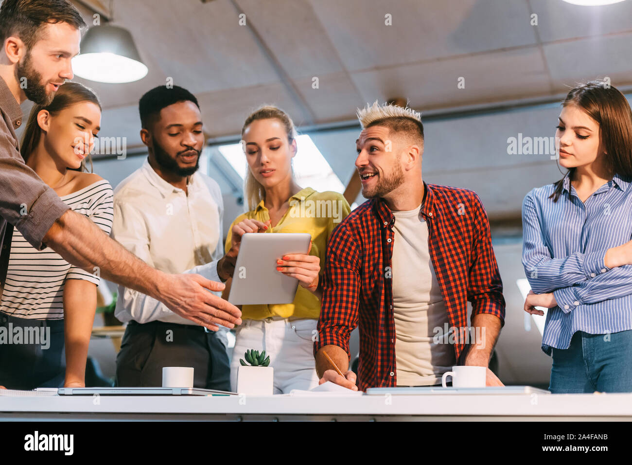 Colleagues brainstorming together, discussing ideas in office Stock ...