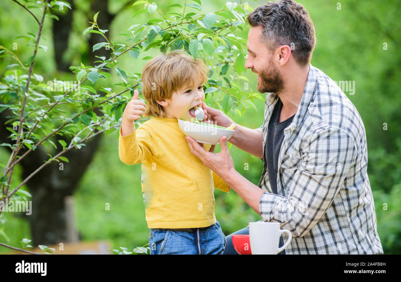 family and parenting. son and father eating. happy fathers day. Little ...