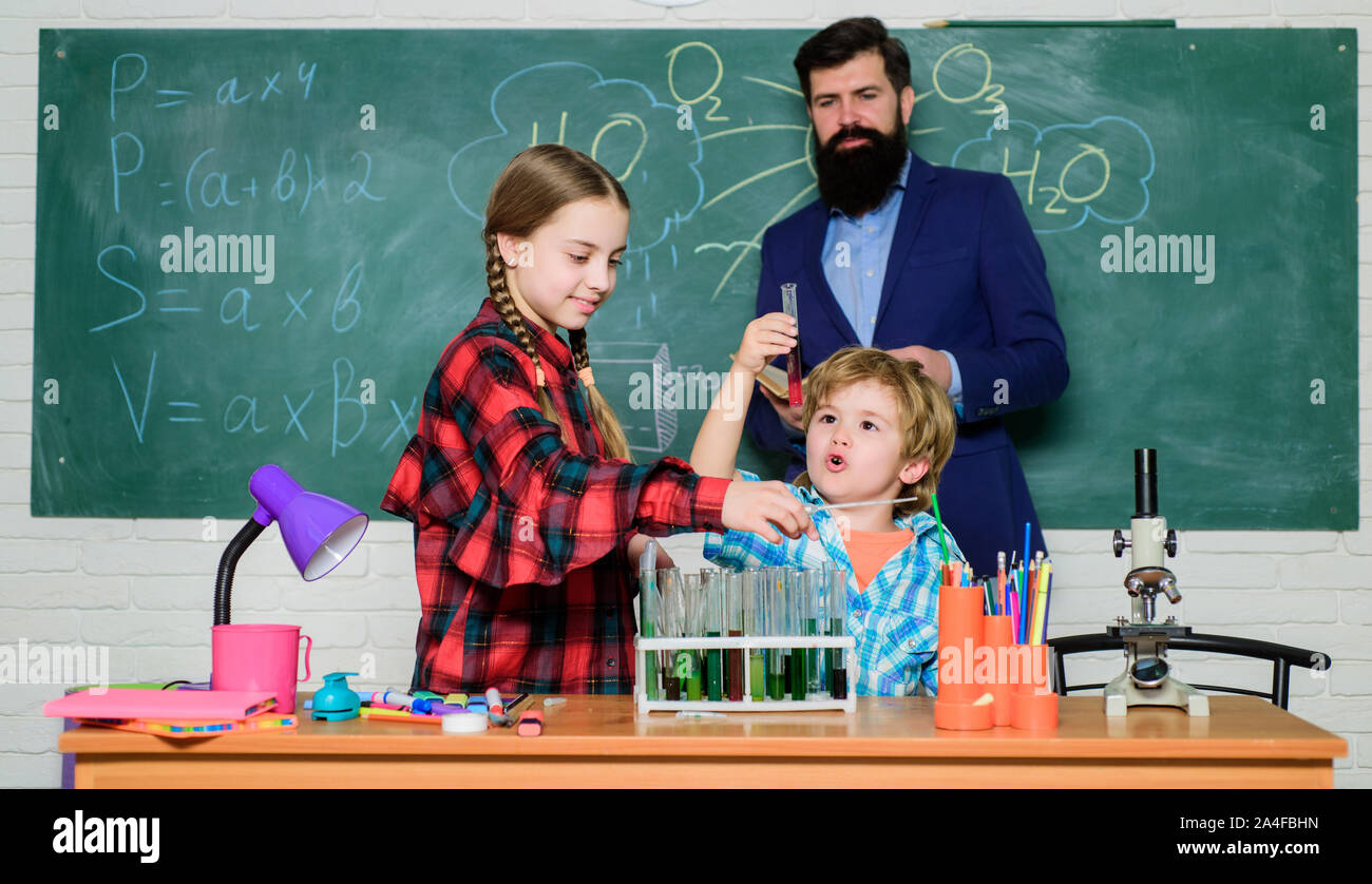 Great medical results. kids in lab coat learning chemistry in school ...