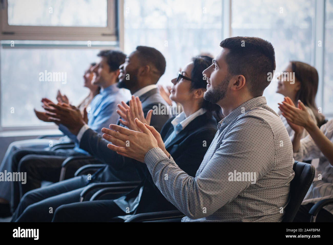 Business conference. Colleagues clapping hands to speaker Stock Photo ...