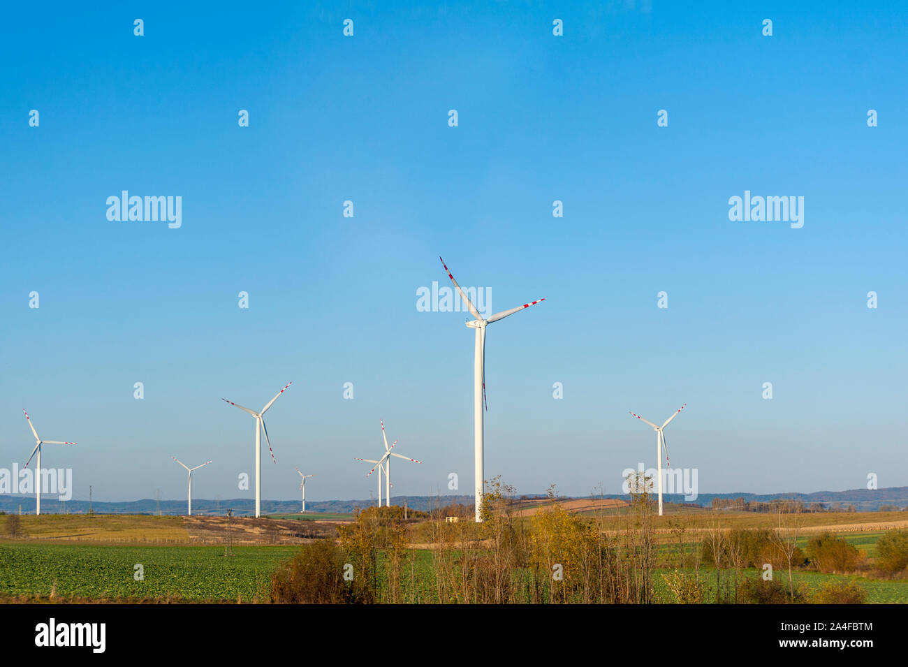 Group of wind turbines. Renewable energy. Electrical windmills Stock ...