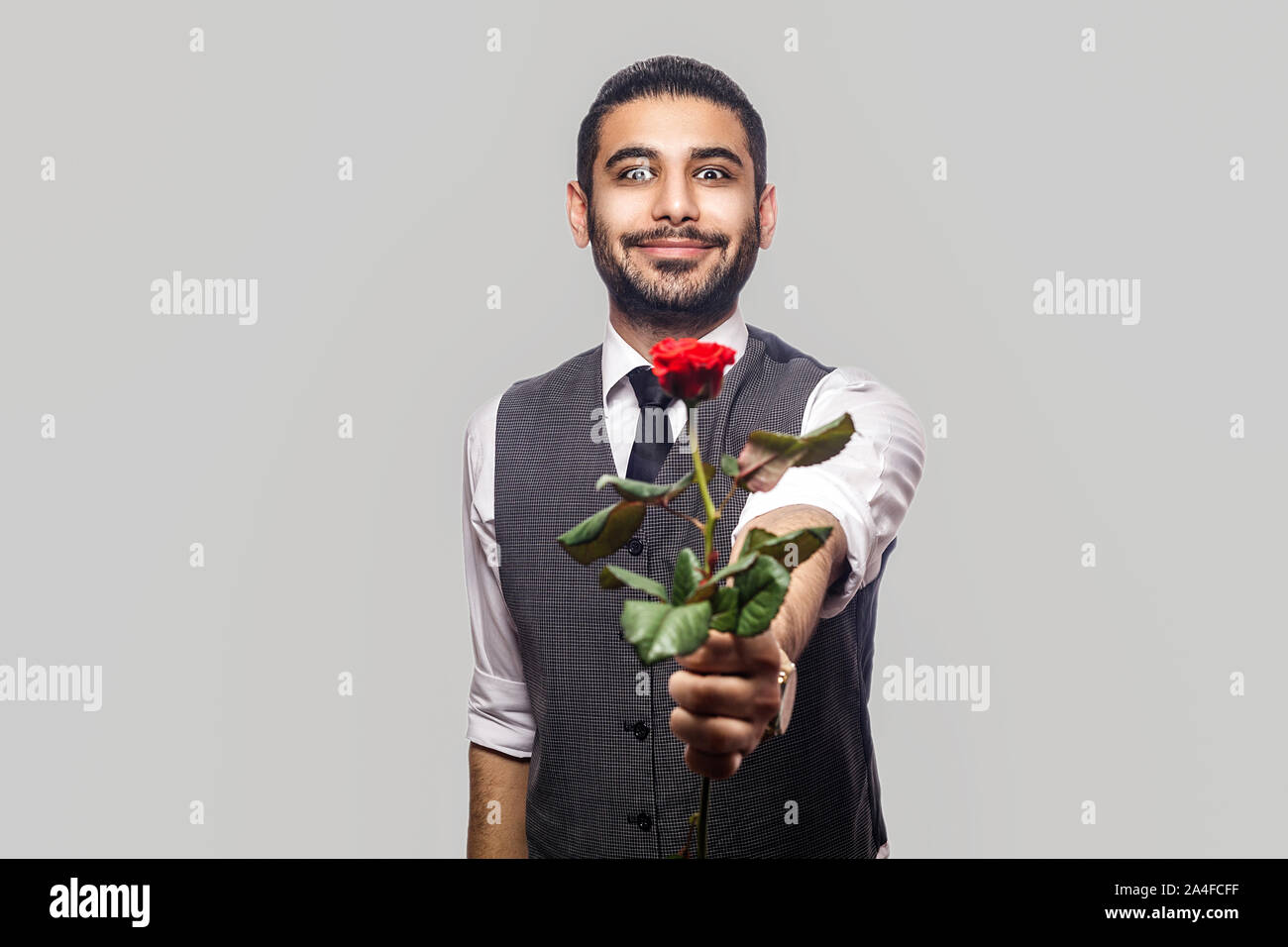 Portrait of funny handsome bearded brunette man in white shirt and ...