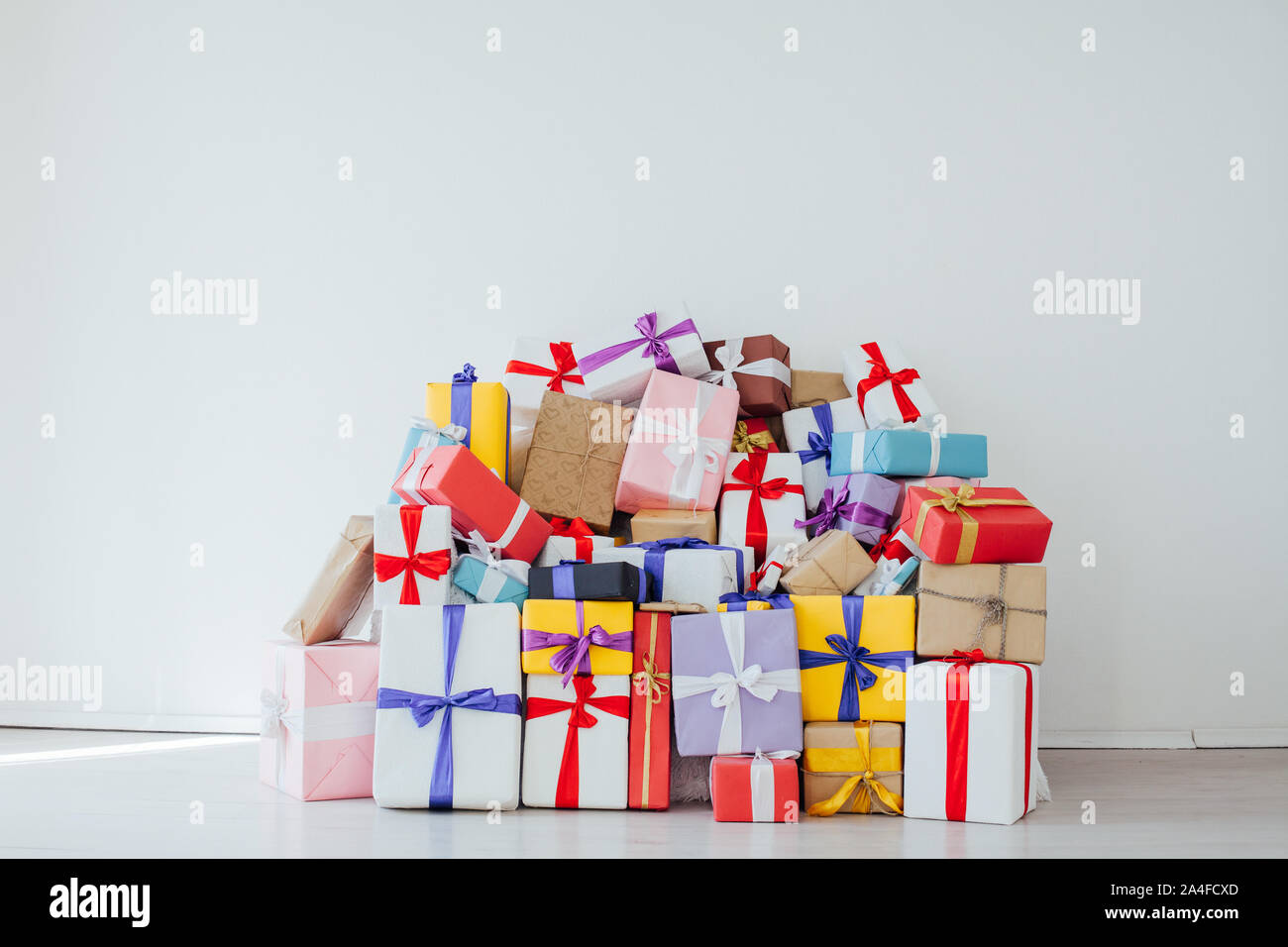 A lot of colorful gifts in the interior of the white room Stock Photo ...