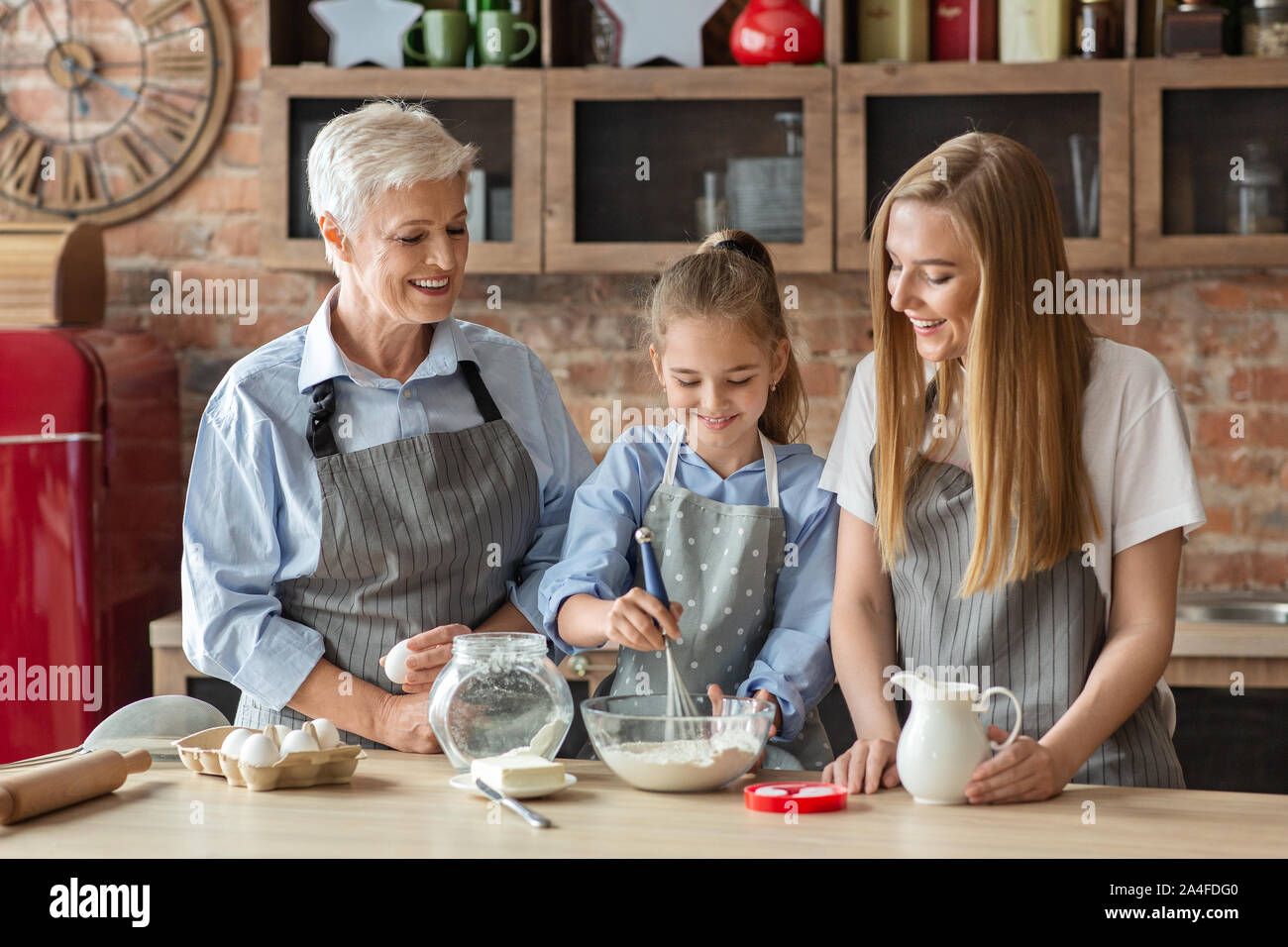 Adorable girl learning how to make pastry Stock Photo - Alamy