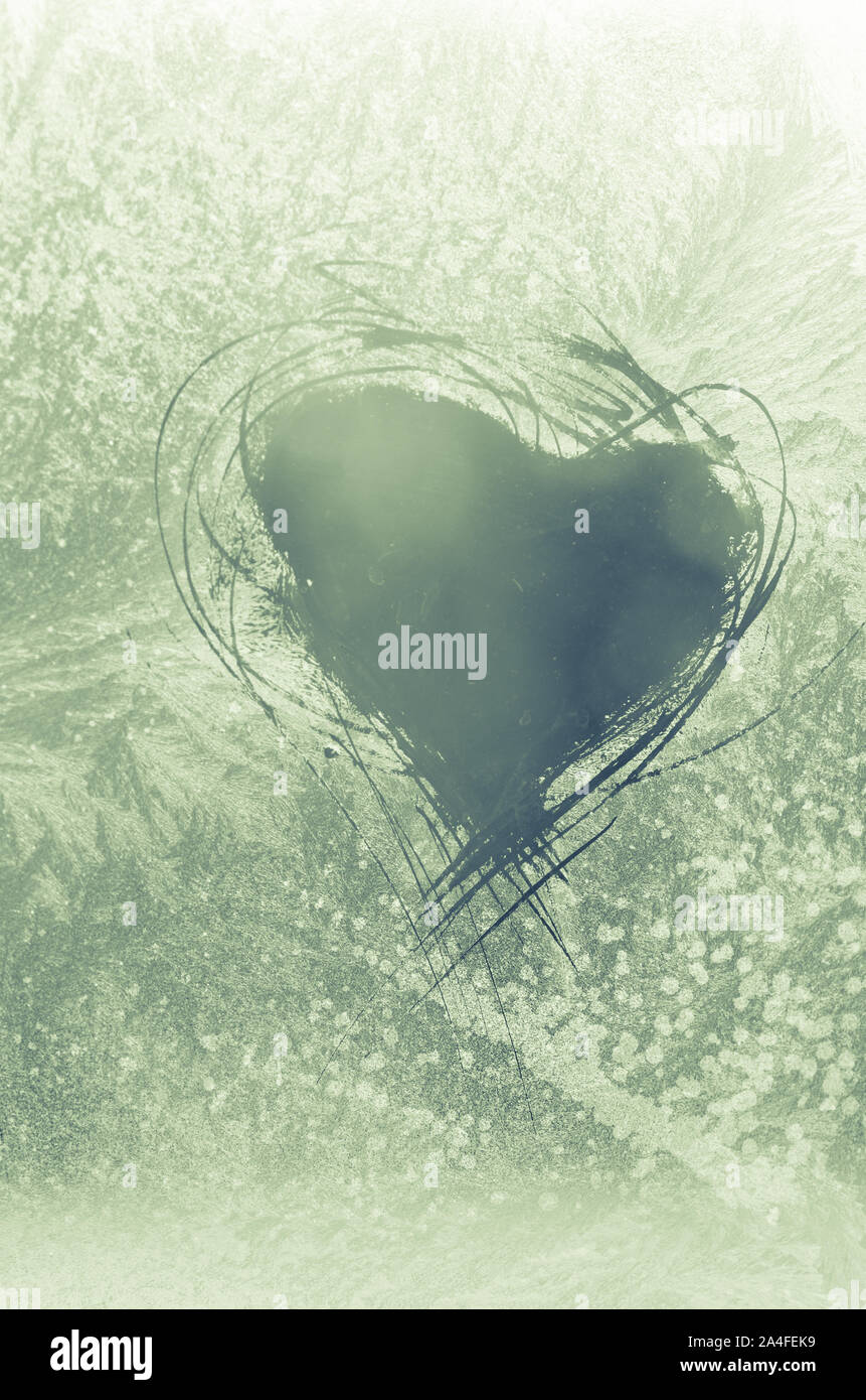 scratched heart shape on frosty pattern on the window Stock Photo - Alamy