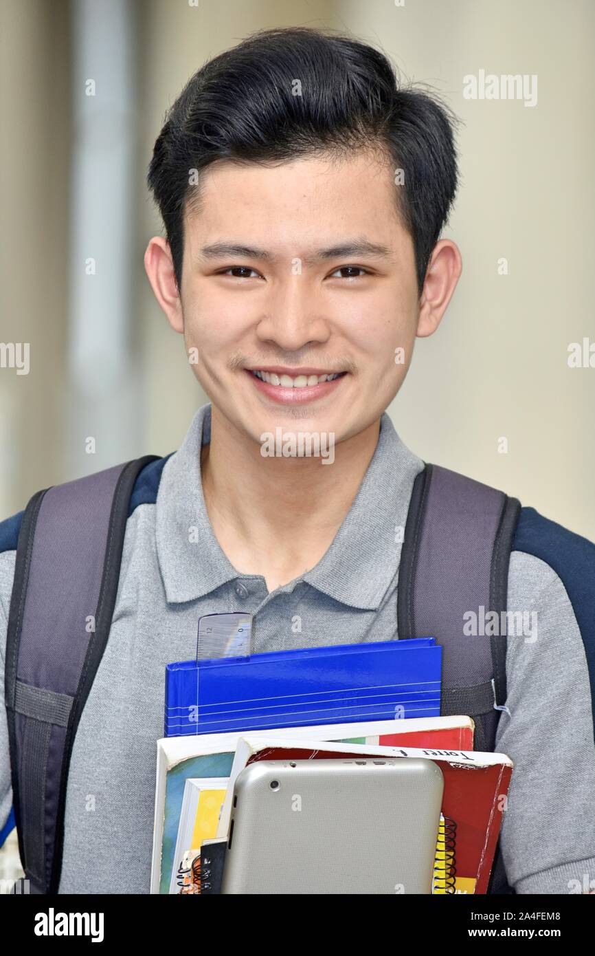 Smiling University Filipino Boy Student With Notebooks Stock Photo - Alamy