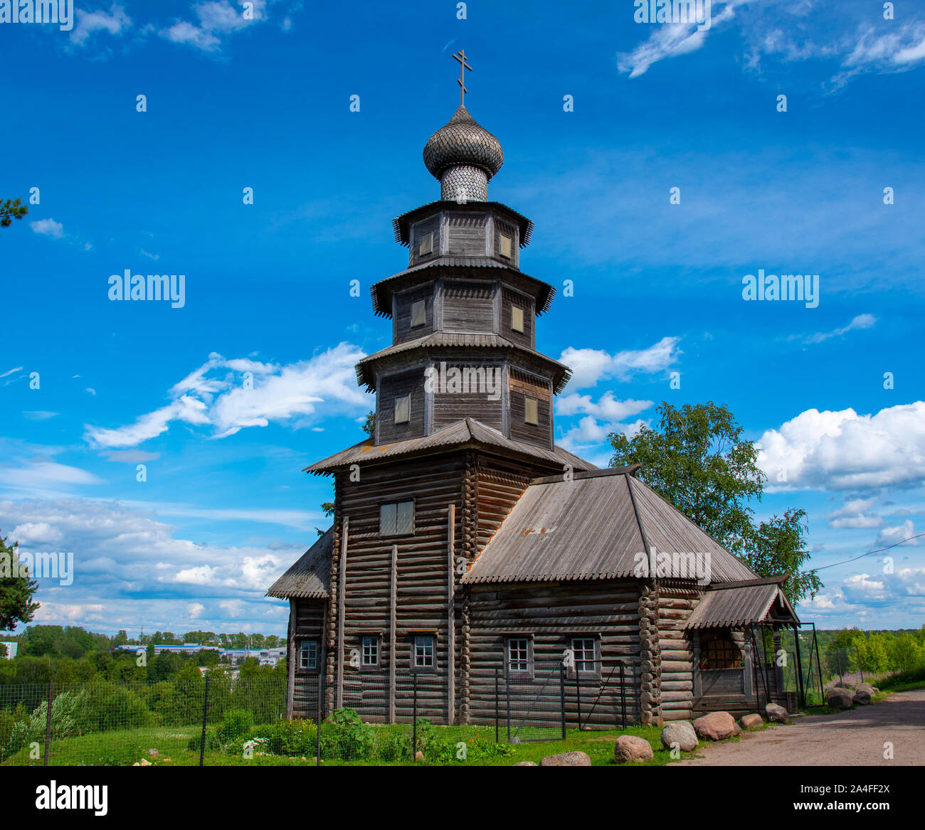 Wooden multi-tiered Church against a bright blue sky Stock Photo - Alamy